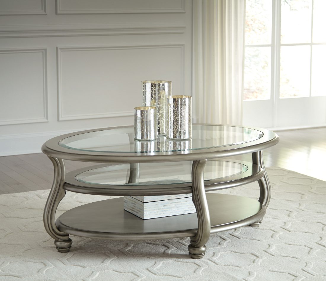 Signature Design by Ashley Coralayne Silver Oval Coffee Table Cole s Appliance Home Furnishings